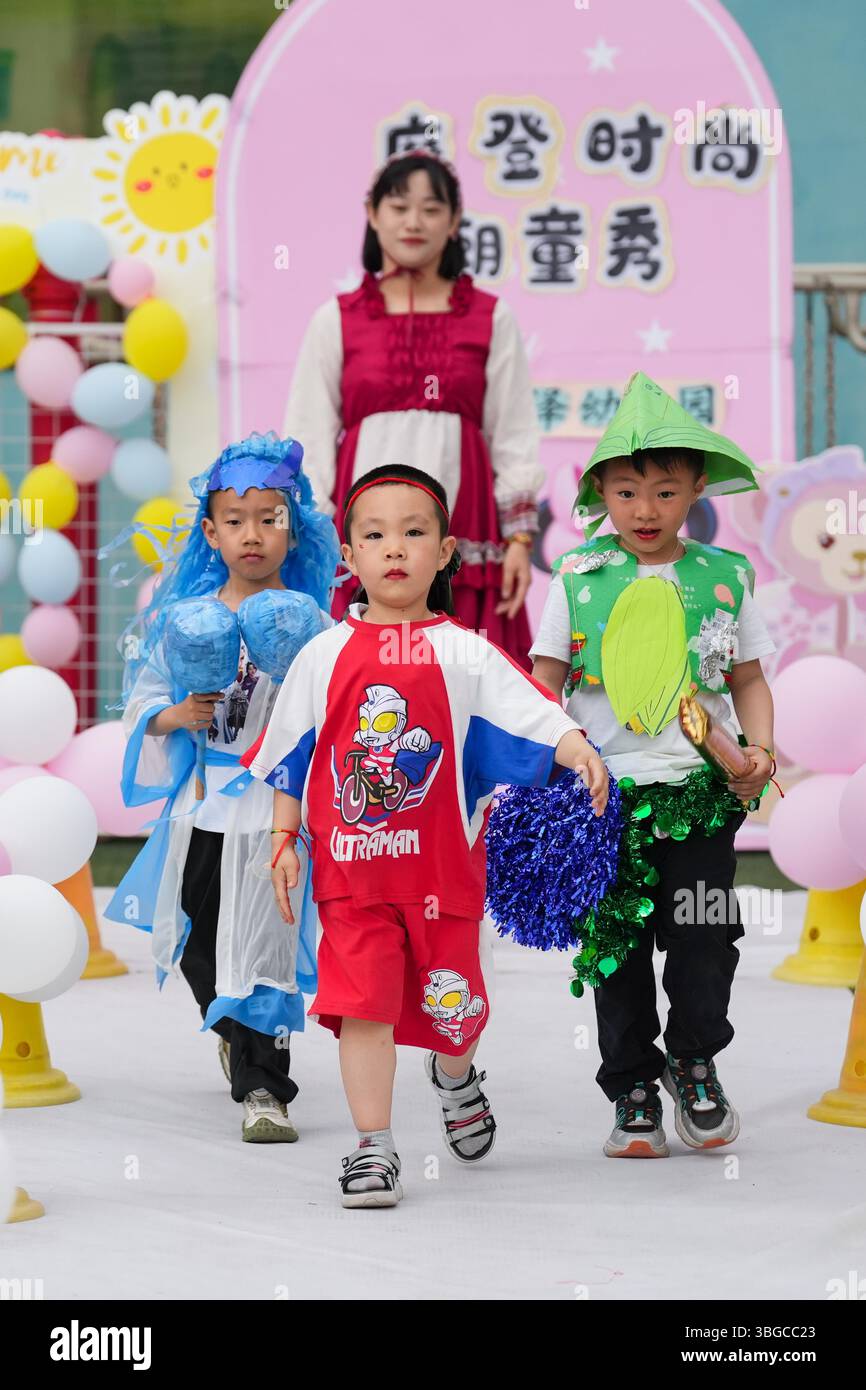 **CHINESE MAINLAND, HONG KONG, MACAU AND TAIWAN OUT** Children perform ...