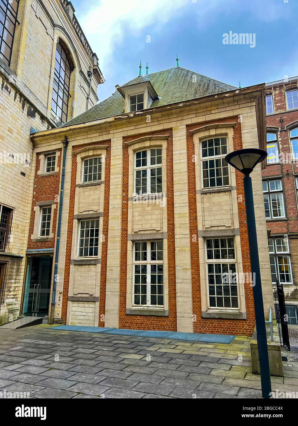 Charming two-story brick office building in Leuven with glass entrance ...