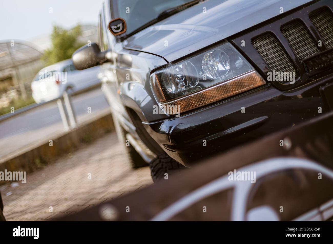 Milan, italy 4 june 2025, close up view of a gray jeep cherokee xj ...