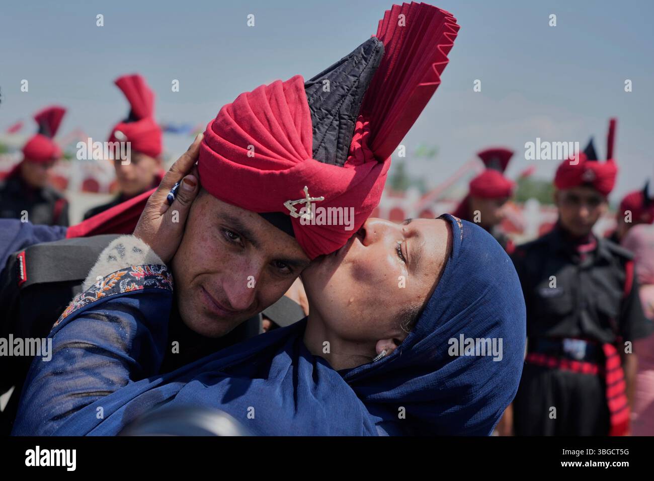 A Kashmiri woman kisses her son, a newly recruited soldier of Indian ...