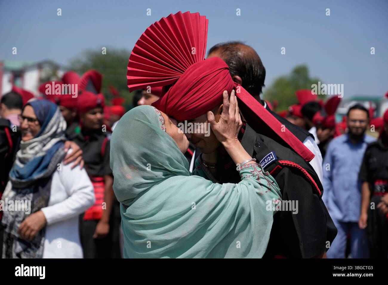 A Kashmiri woman kisses her son, a newly recruited soldier of Indian ...