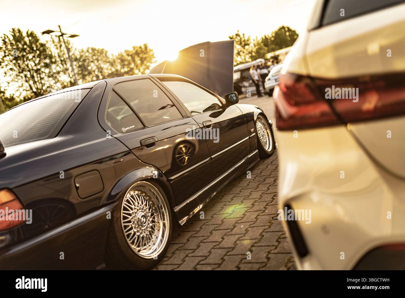 Milan, italy 4 june 2025, customized bmw e36 with shiny chrome rims ...