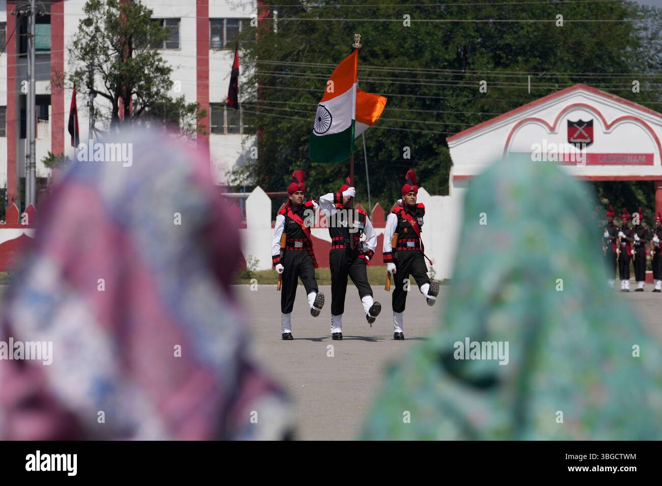 Family members watch as new recruits of the Indian army soldier take ...
