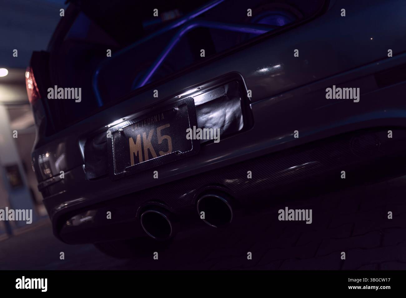 Milan, italy 4 june 2025, rear view of a tuned car with open trunk ...