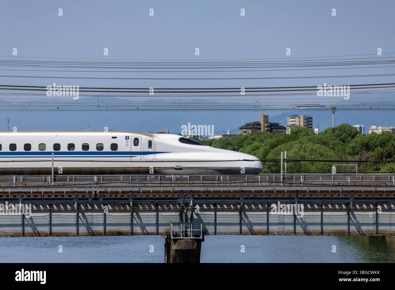 Japan's Nozomi Shinkansen Bullet train captured on a bridge crossing ...