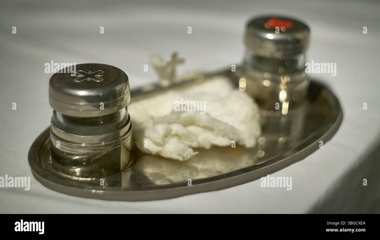 Silver tray holding the chrism oils and cotton for the sacrament of ...