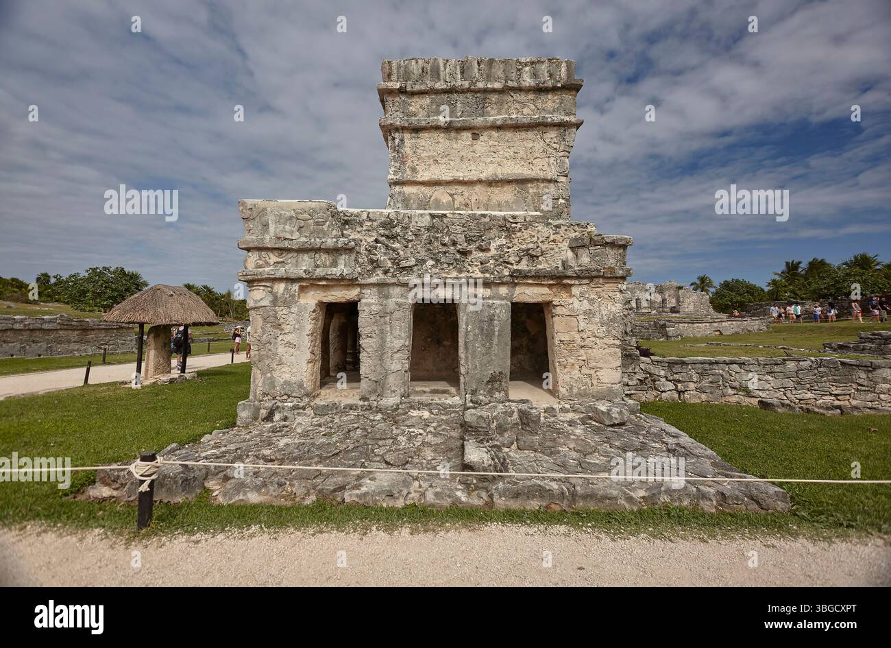Tourists exploring ancient mayan ruins in tulum, mexico, a popular ...