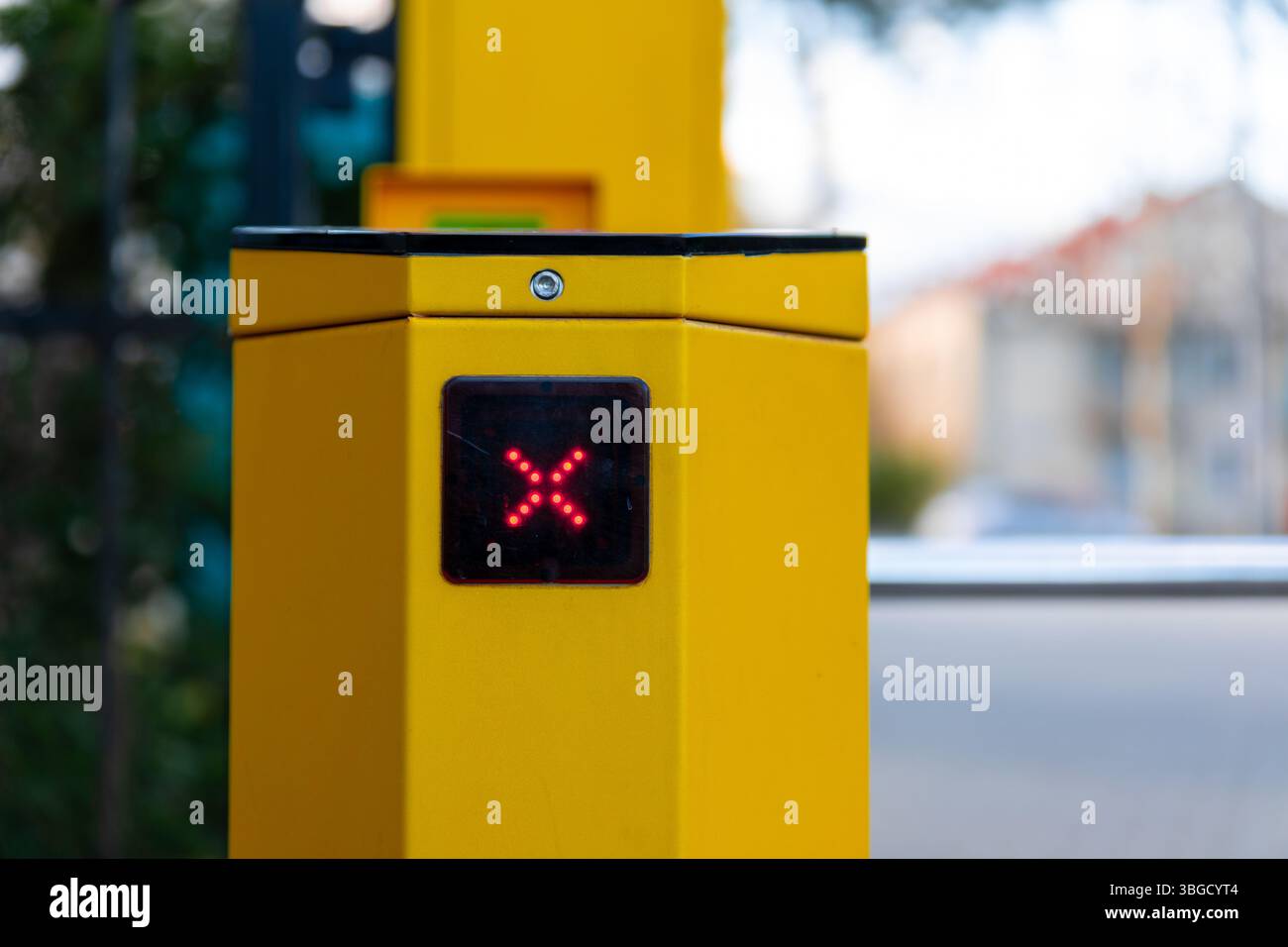 Detailed view of a yellow turnstile gate showing a red "X" LED display ...