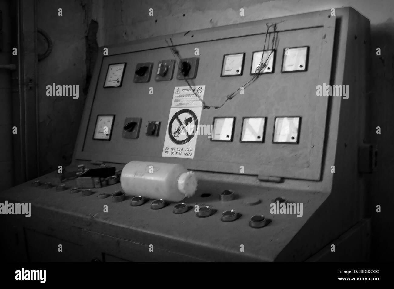 Vintage control panel in a derelict industrial setting, displaying ...