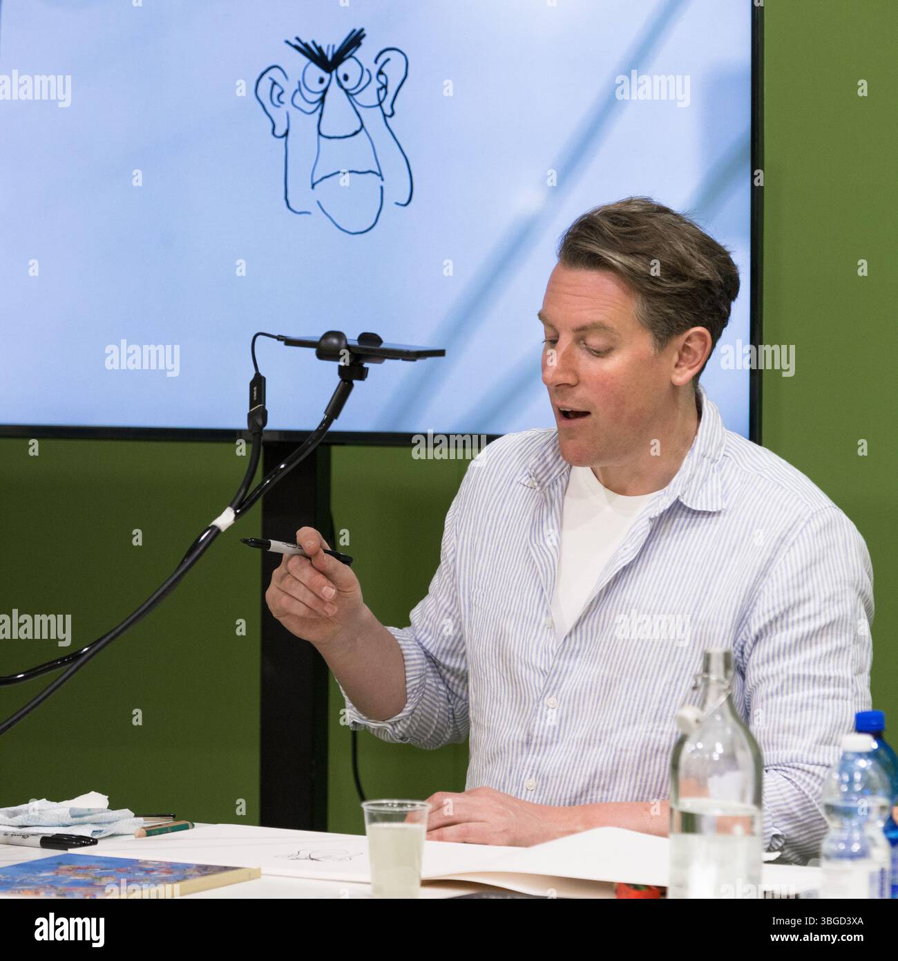 Turin, Italy. 16th May 2025. Illustrator Sam Usher drawing lesson at ...