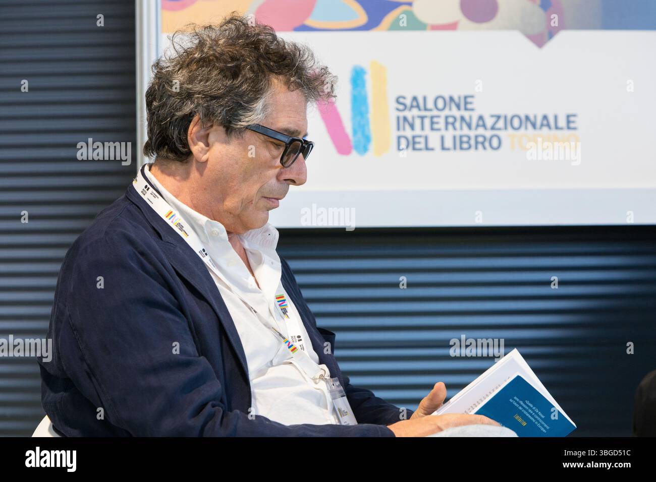 Turin, Italy. 16th May 2025. Italian writer Sandro Veronesi reading a ...