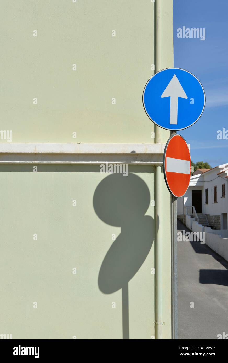 traffic signs and their shadows on a building wall Stock Photo - Alamy