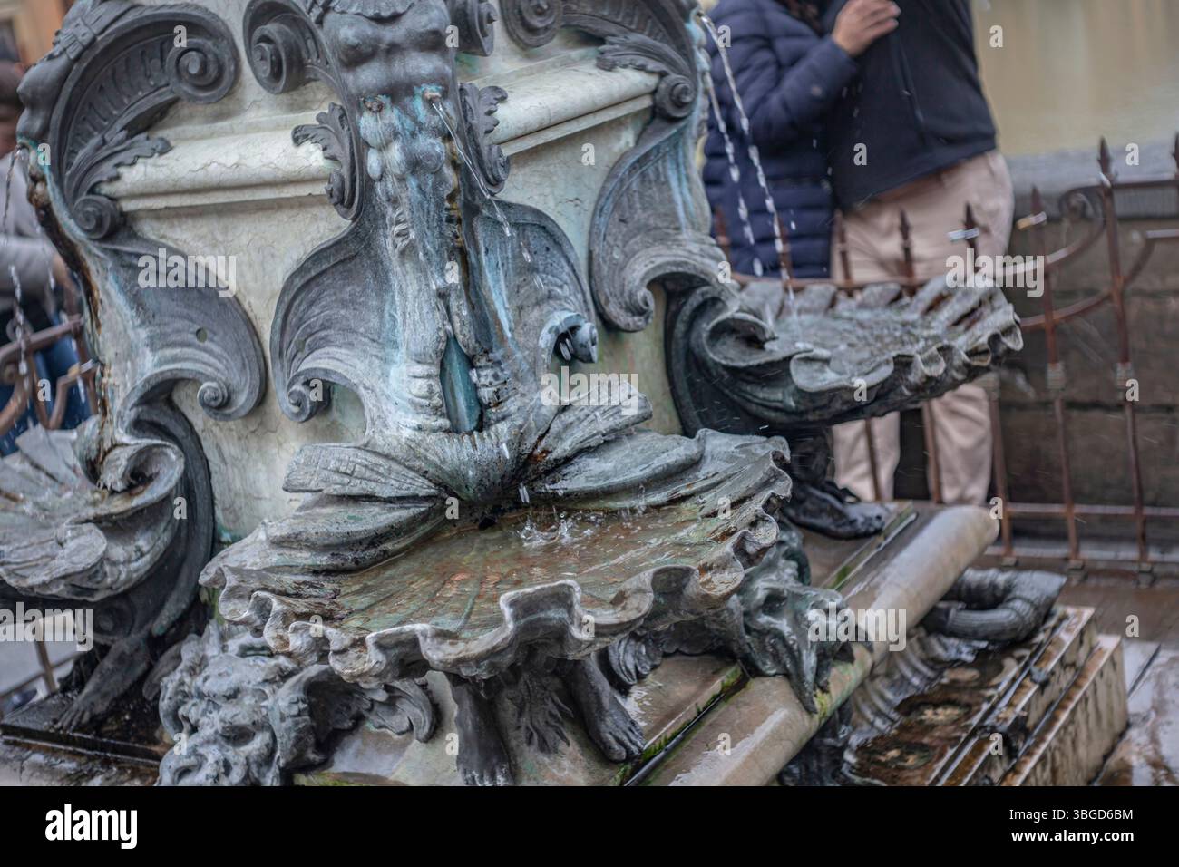 Florence, Italy 1 January 2025: Water pouring from a fountain featuring ...