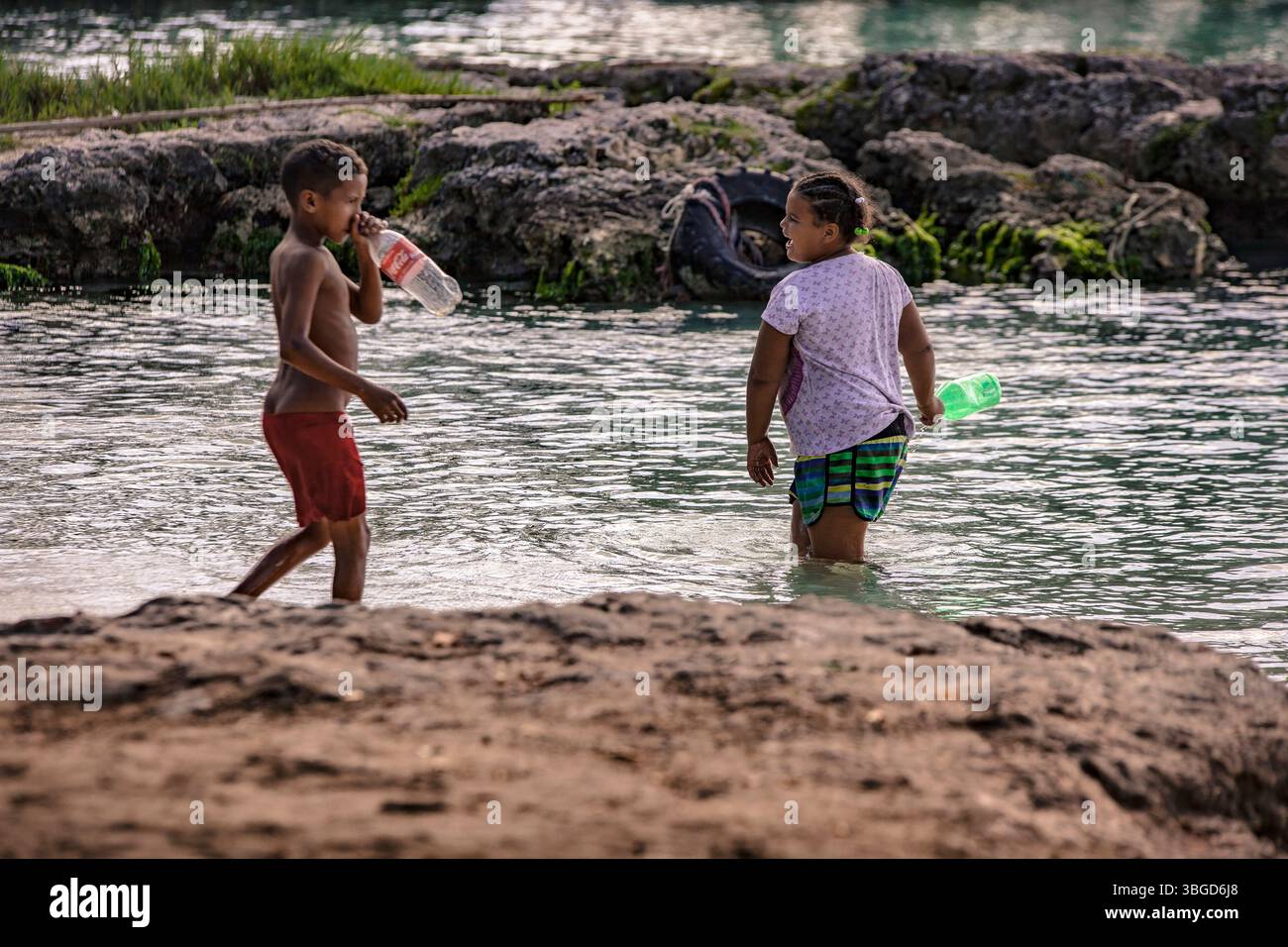 Bayahibe, Dominican Republic 1 January 2025: Two dominican kids playing ...