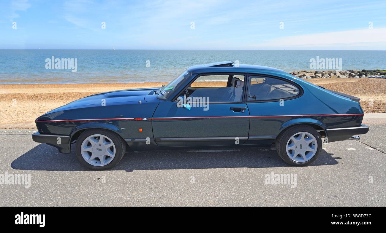 Classic Dark Blue Ford Capri 280 parked on seafront promenade Stock ...