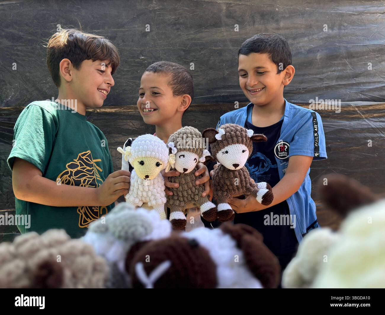 The Palestinian displaced woman, Reham Sharab, 30, uses her crochet ...