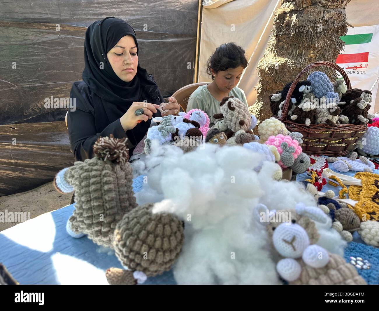 The Palestinian displaced woman, Reham Sharab, 30, uses her crochet ...
