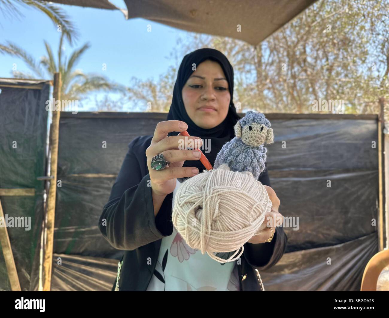 The Palestinian displaced woman, Reham Sharab, 30, uses her crochet ...