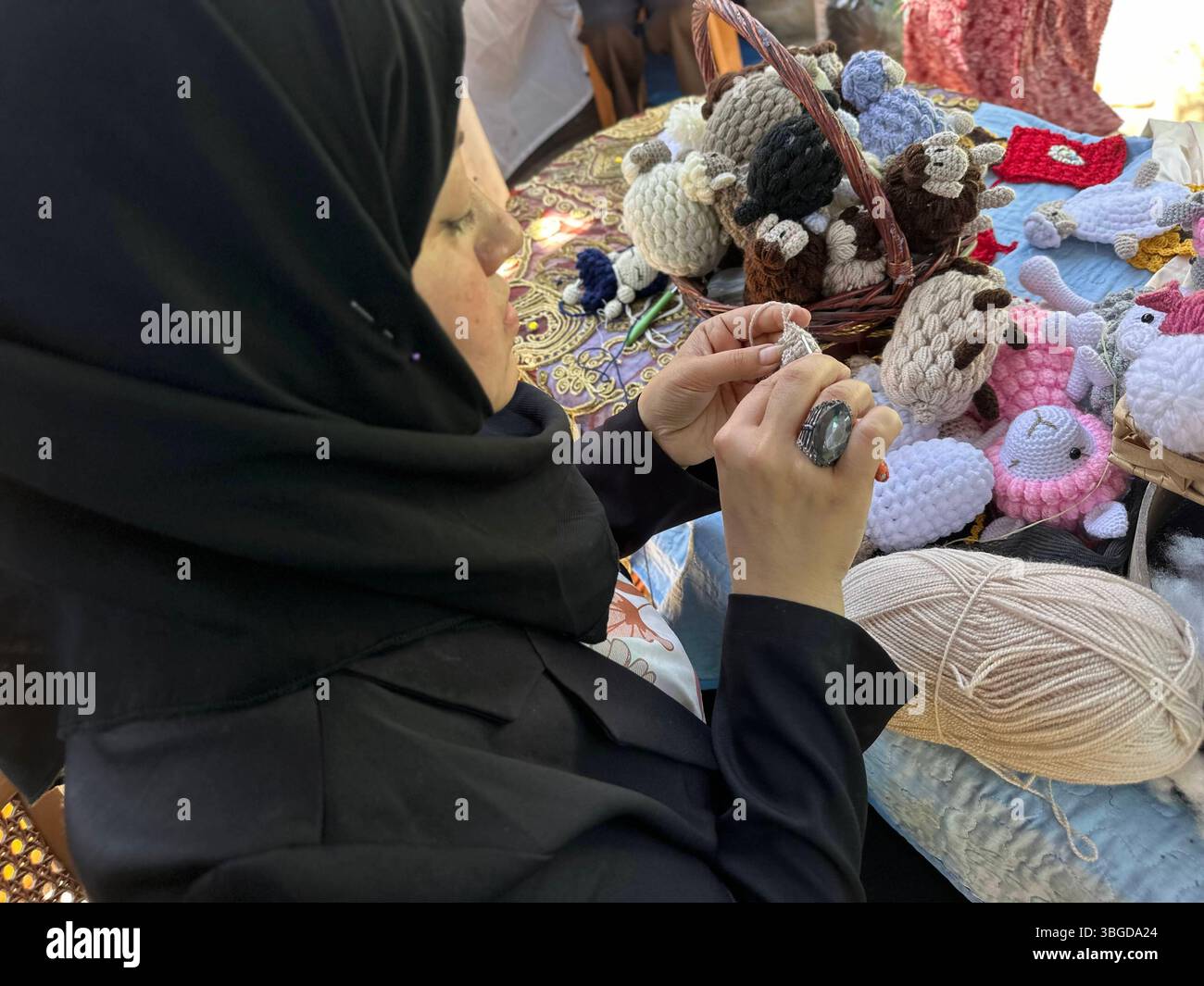 The Palestinian displaced woman, Reham Sharab, 30, uses her crochet ...