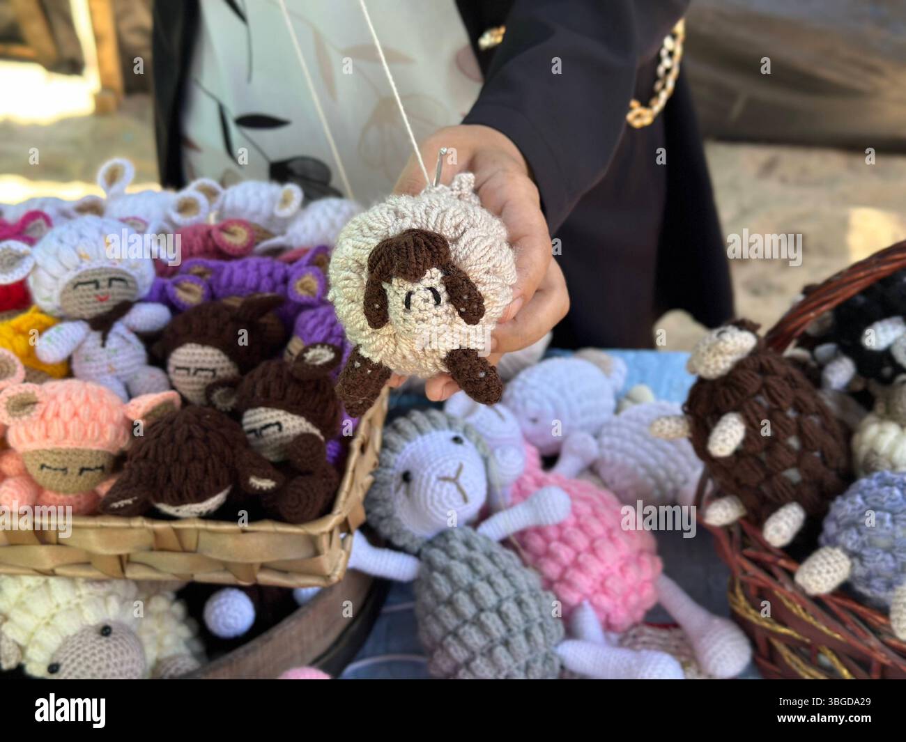 The Palestinian displaced woman, Reham Sharab, 30, uses her crochet ...