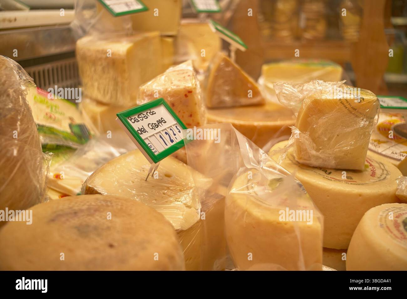 Milan, Italy 1 January 2025: Variety of cheeses displayed in a market ...
