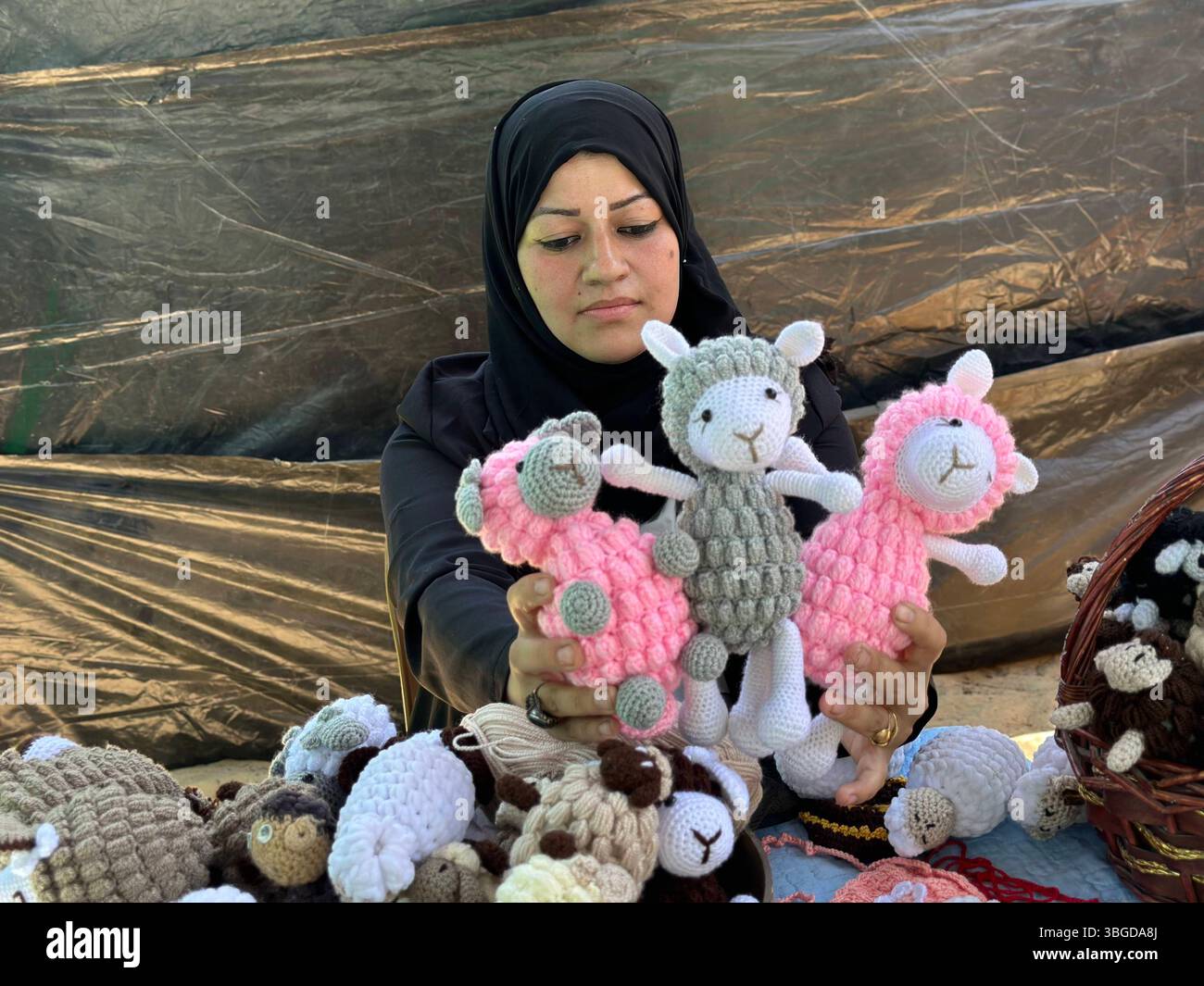 The Palestinian displaced woman, Reham Sharab, 30, uses her crochet ...