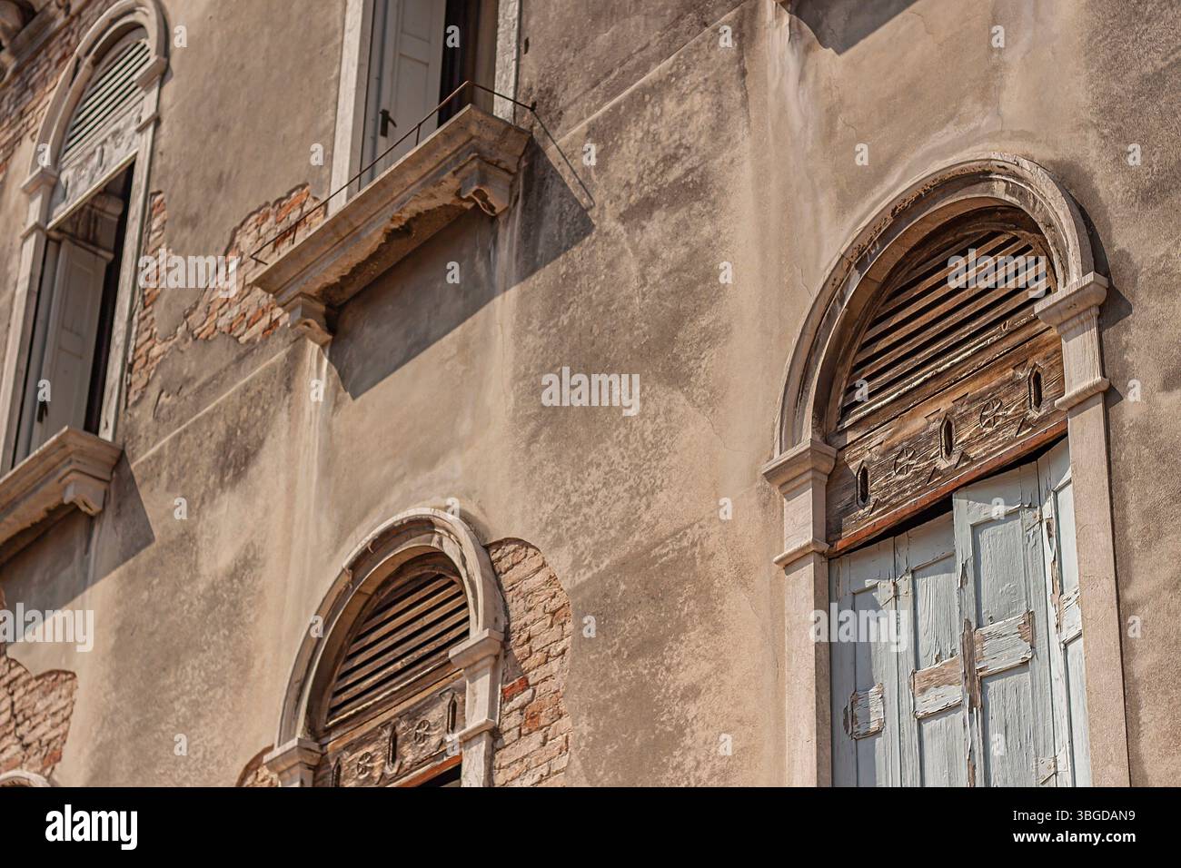 Venice, Italy 1 January 2025: Weathered facade of an old building in ...