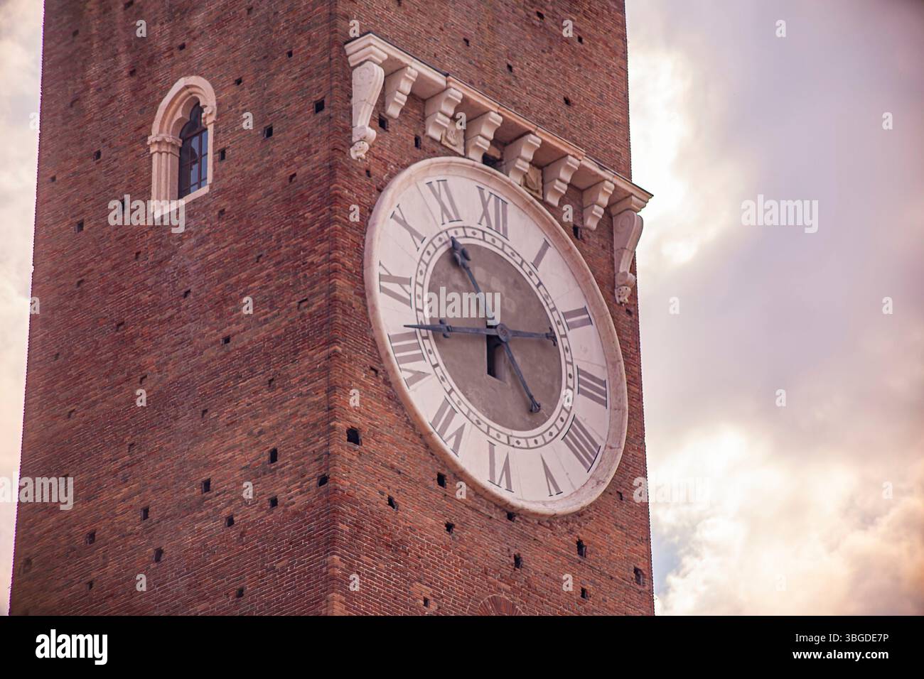 Verona, Italy 1 January 2025: Roman numerals clock on the medieval ...
