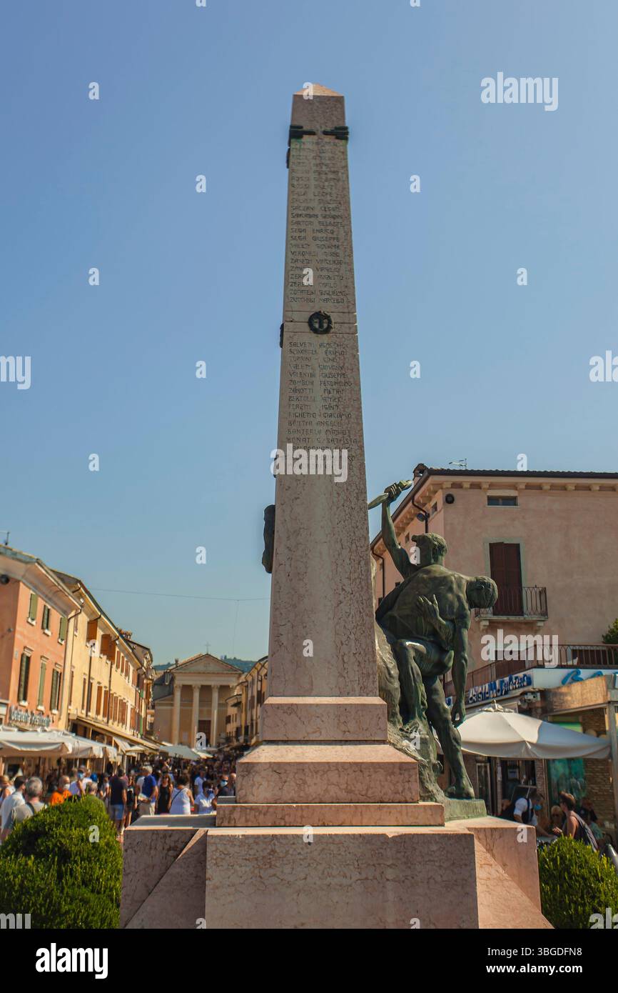 Garda Lake, Italy 3 January 2025: Bronze statue of a soldier carrying a ...