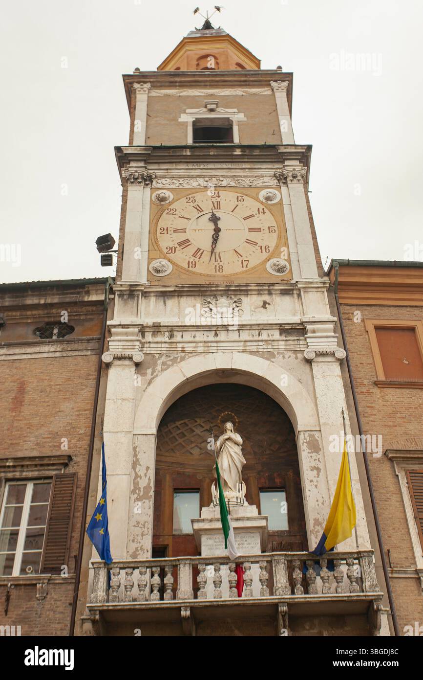 Modena, Italy 1 January 2025: Ancient clock tower with roman numerals ...