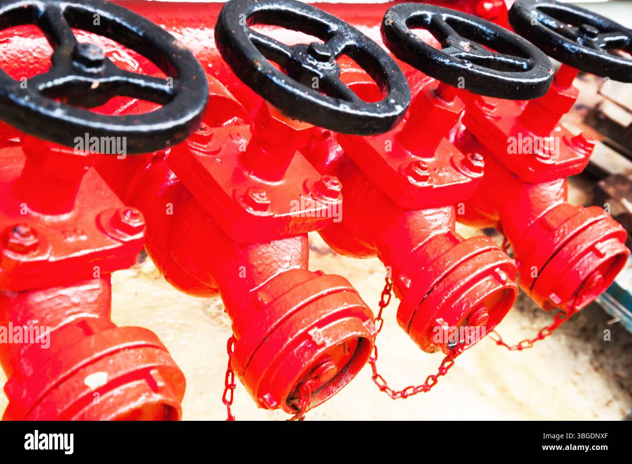 Four red fire hydrants on a fire line on a ship Stock Photo - Alamy