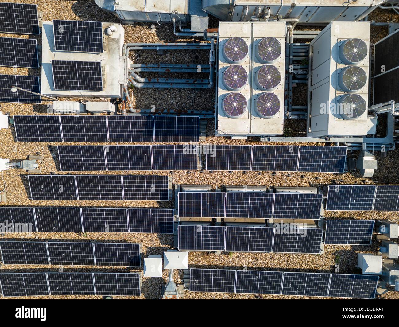 Aerial view of rooftop solar panels and industrial HVAC systems on a ...