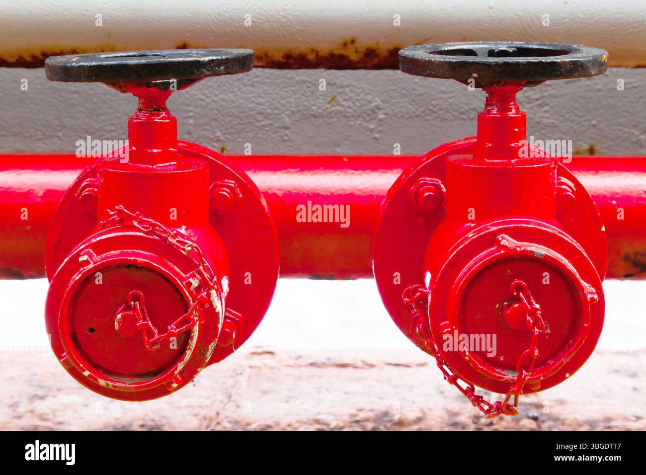 Two red fire hydrants on a fire line on a ship close-up Stock Photo - Alamy