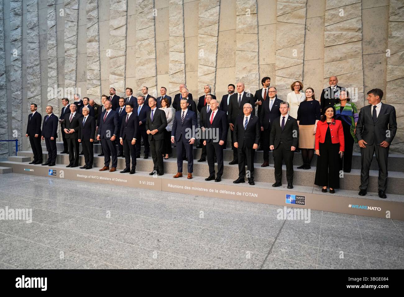 Ministers and military representatives pose during a group photo of ...