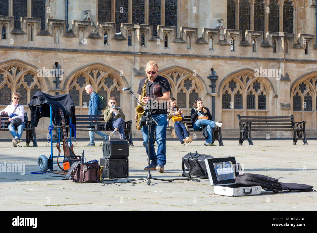 Busker musician performing in Bath Abbey church yard, city of Bath ...