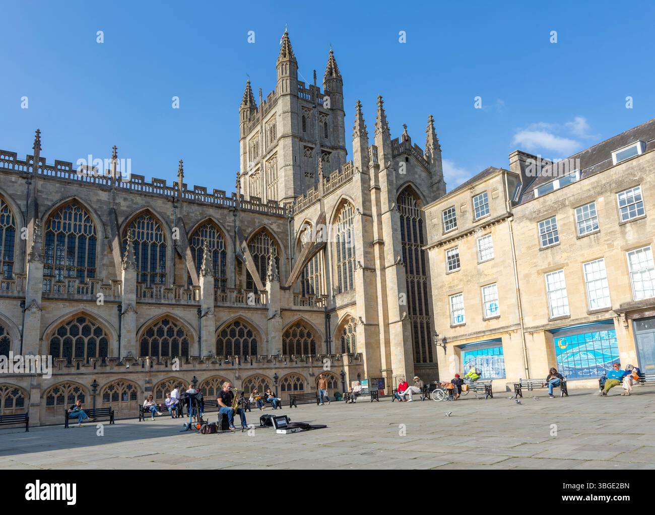 Busker musician performing in Bath Abbey church yard, city of Bath ...