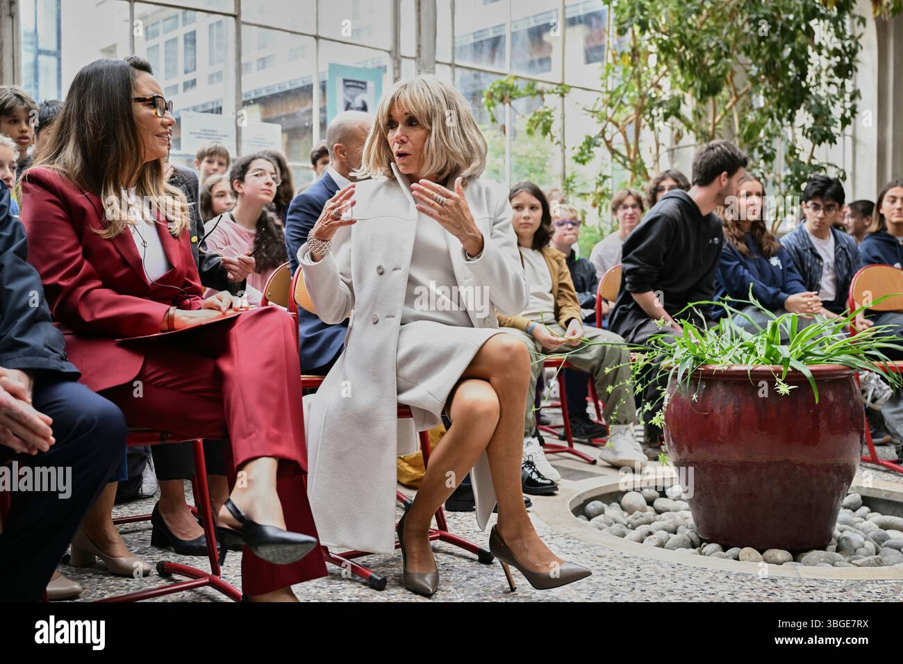 Brigitte Macron, wife of France's President Emmanuel Macron, right ...