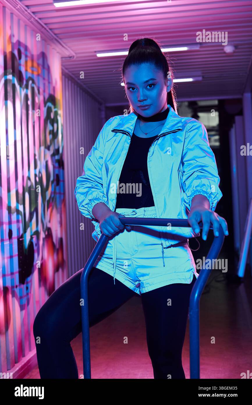 A beautiful woman exudes style and confidence in a brightly lit ...