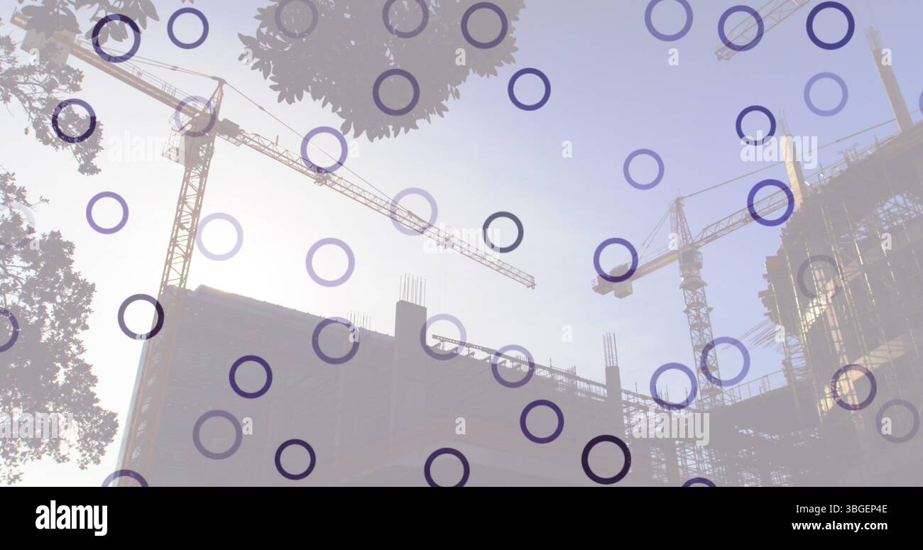 Image of falling circles over construction site Stock Photo - Alamy