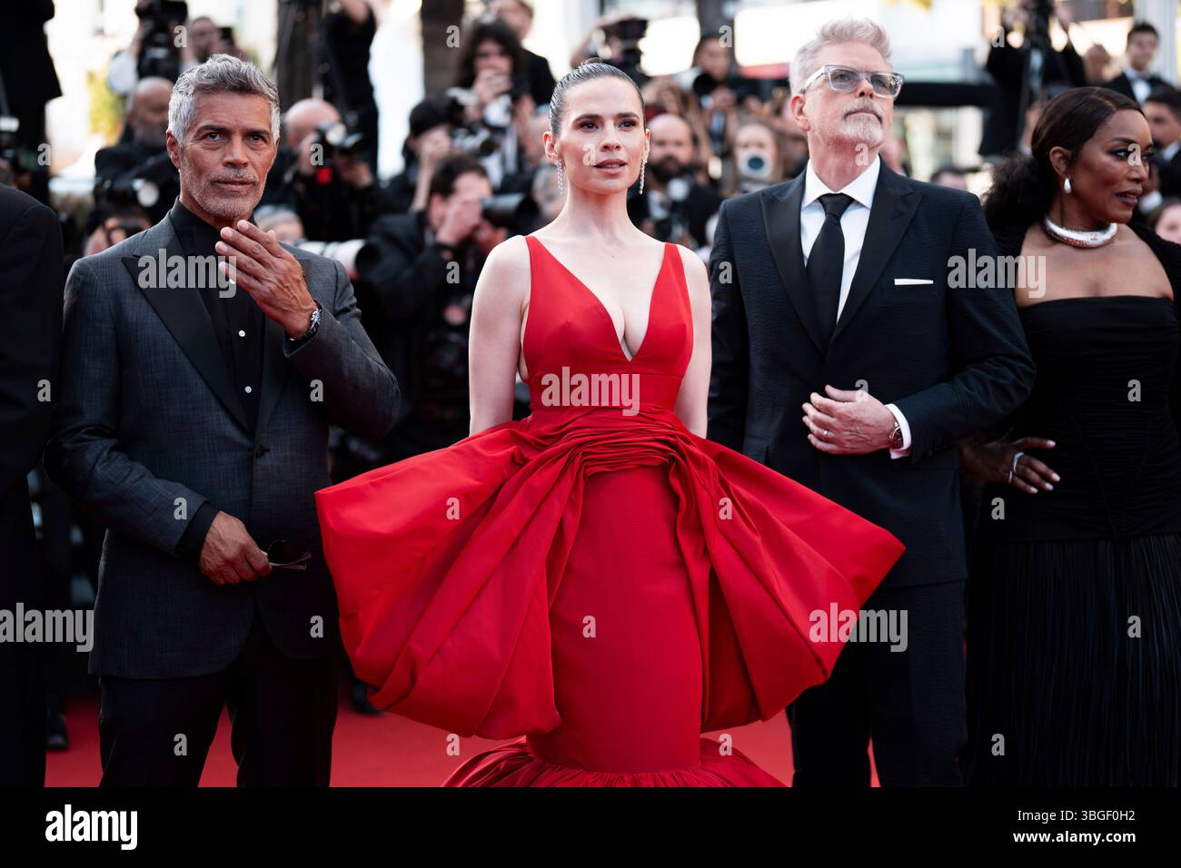 Esai Morales, from left, Hayley Atwell, and Christopher McQuarrie pose ...