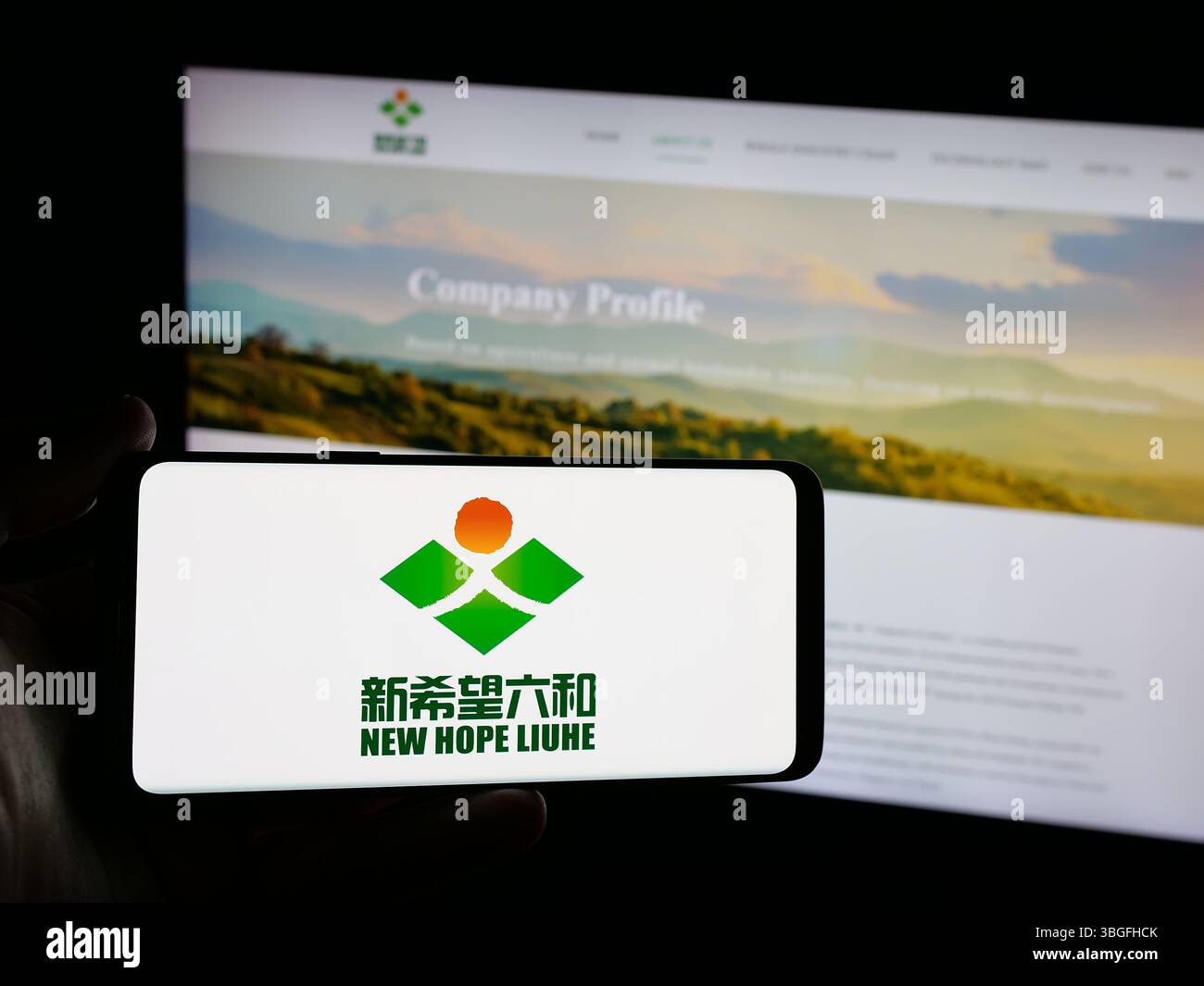 Stuttgart, Germany - 03-06-2025: Person holding smartphone with logo of Chinese food company New ...