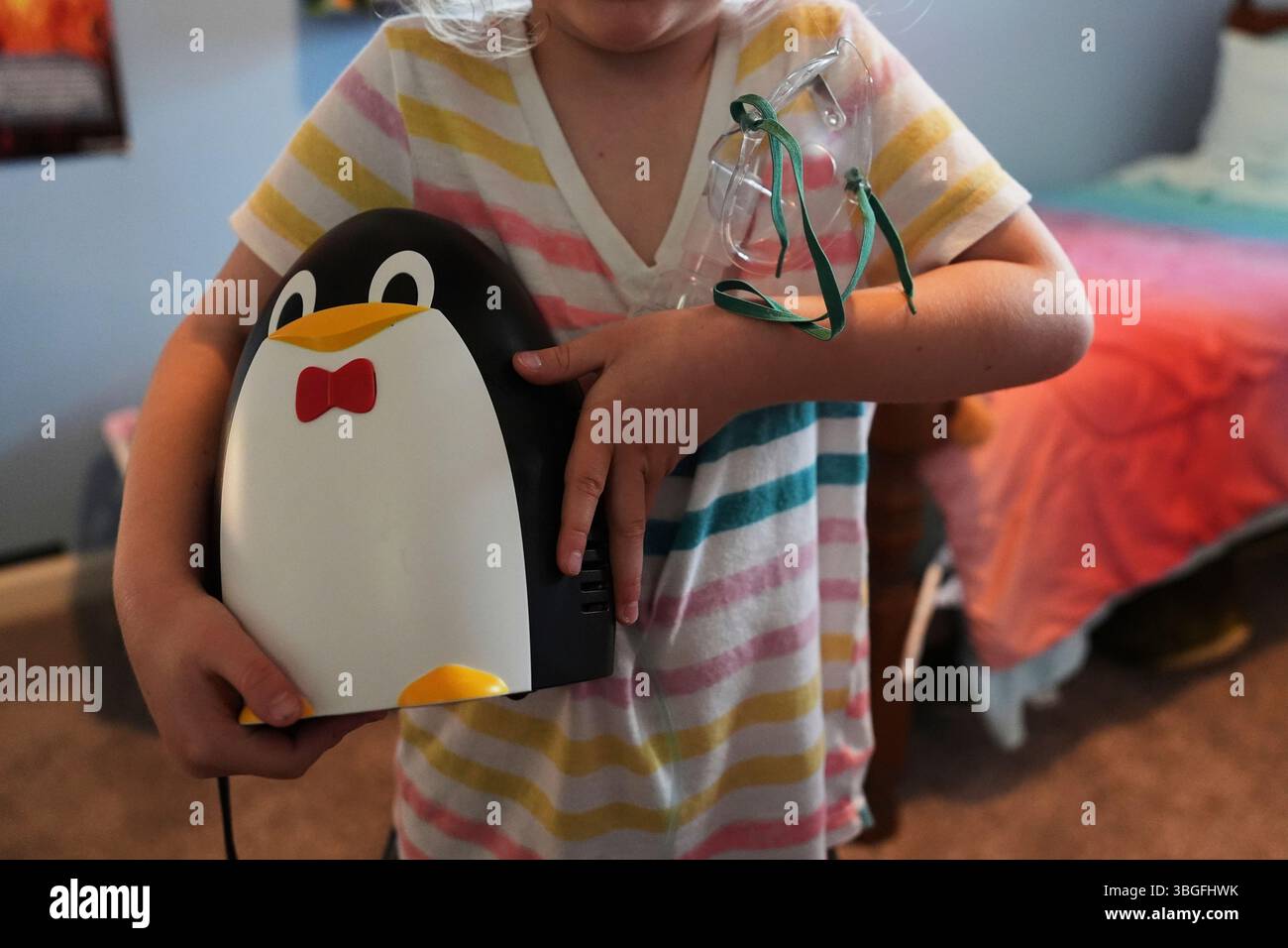 Eliza Ethridge, 5, holds her nebulizer Thursday, April 10, 2025, in ...