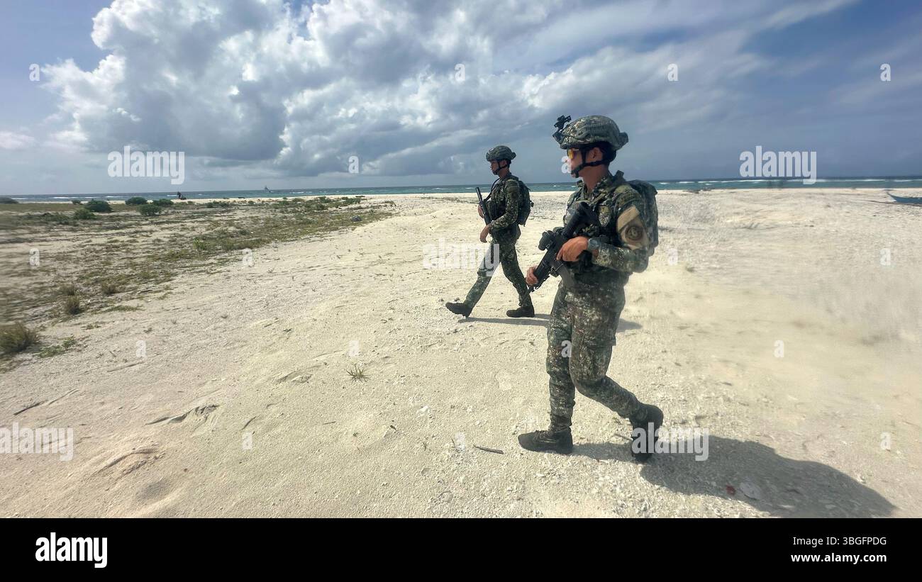 Philippine marines patrol at West York Island, locally called Likas ...