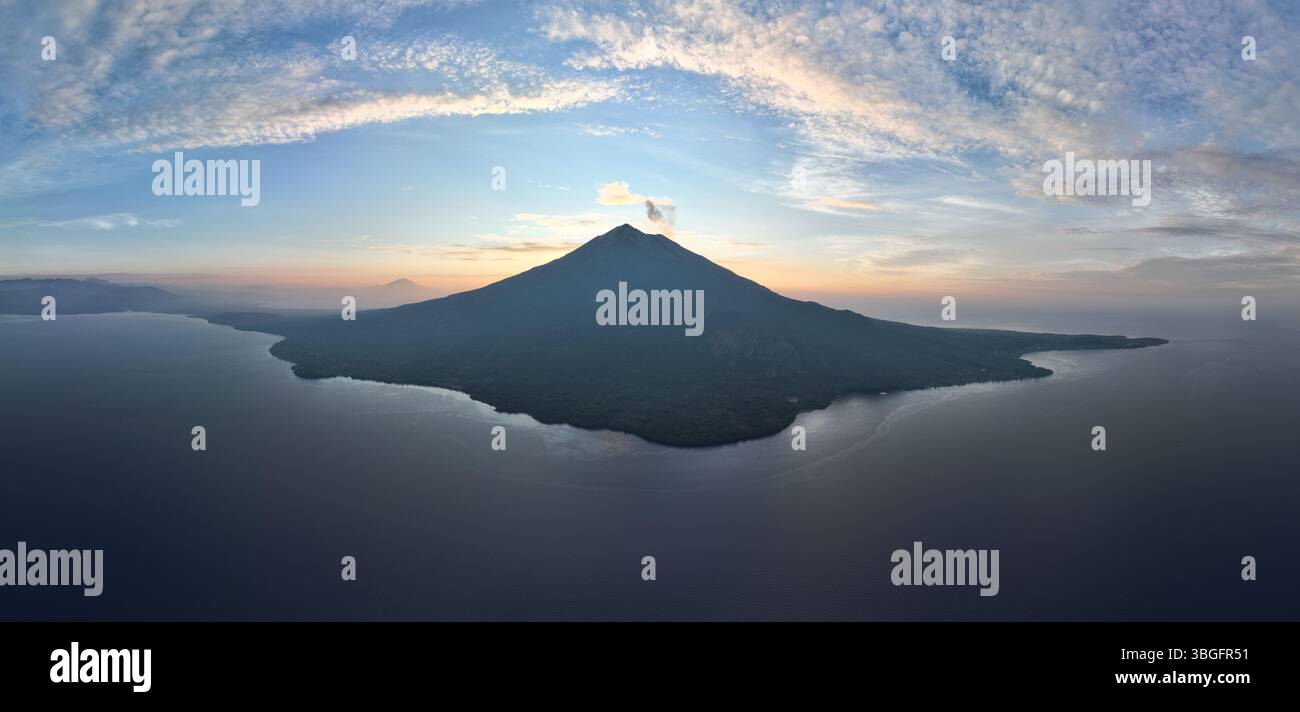 Sunset silhouettes Iliape volcano on Lembata Island in the Lesser Sunda ...