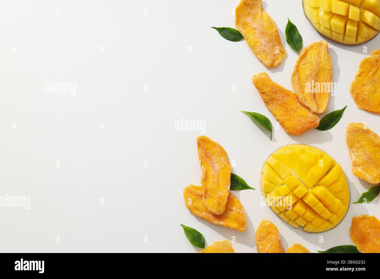 Dried mango chips with fresh sliced mango Stock Photo - Alamy