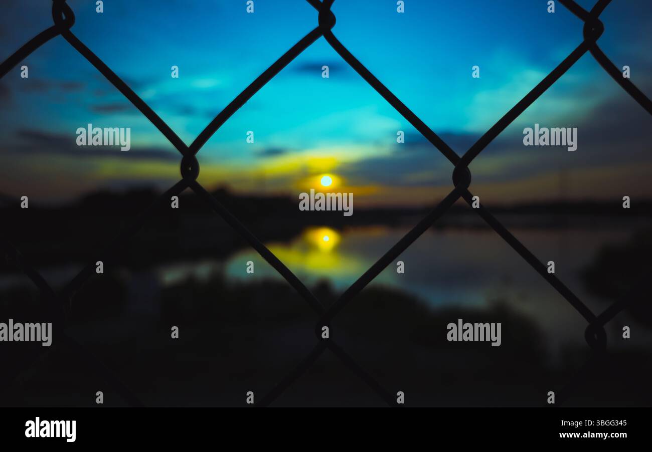 Sunset Behind the Fence – Freedom Beyond Boundaries Stock Photo - Alamy