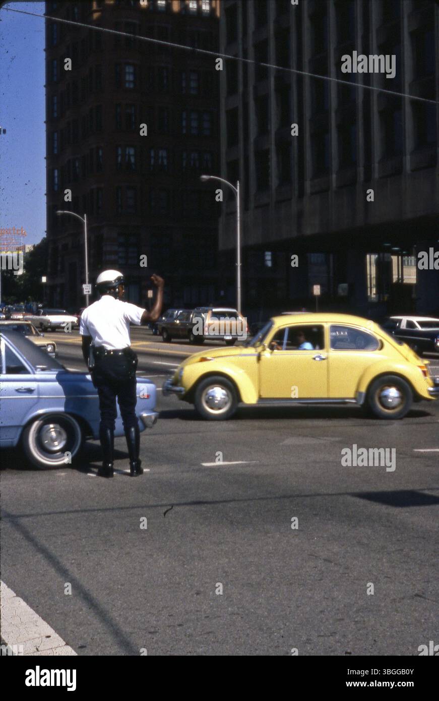 A police officer directs traffic at the intersection of S Front Street ...
