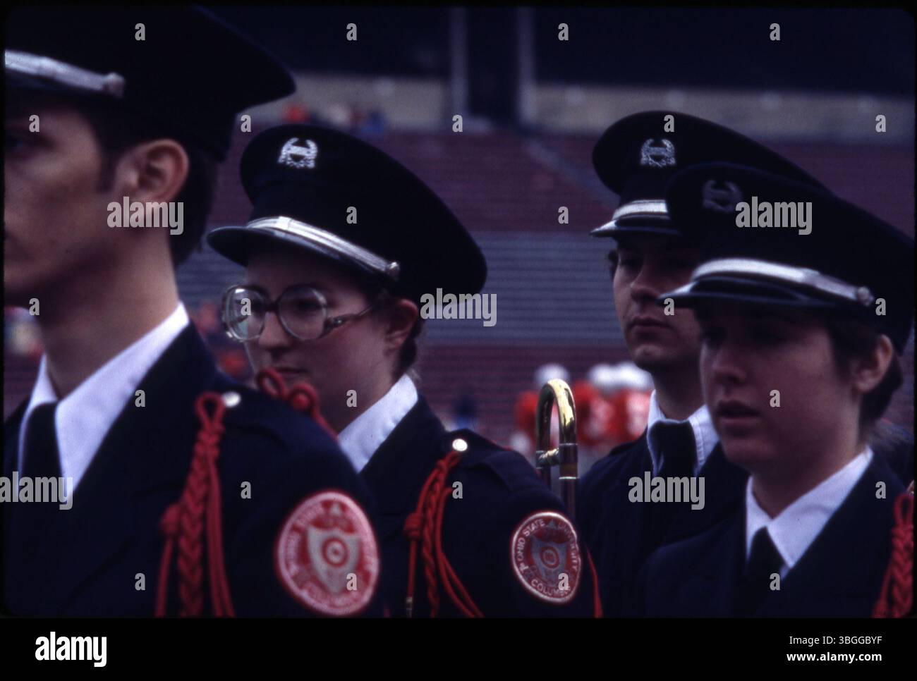 Four members of the Ohio State University Marching Band stand in full ...