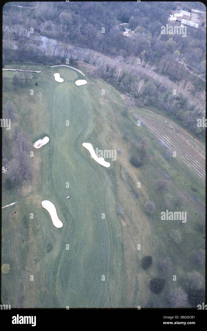 An aerial view of a golf course hole at the Columbus Country Club, with ...