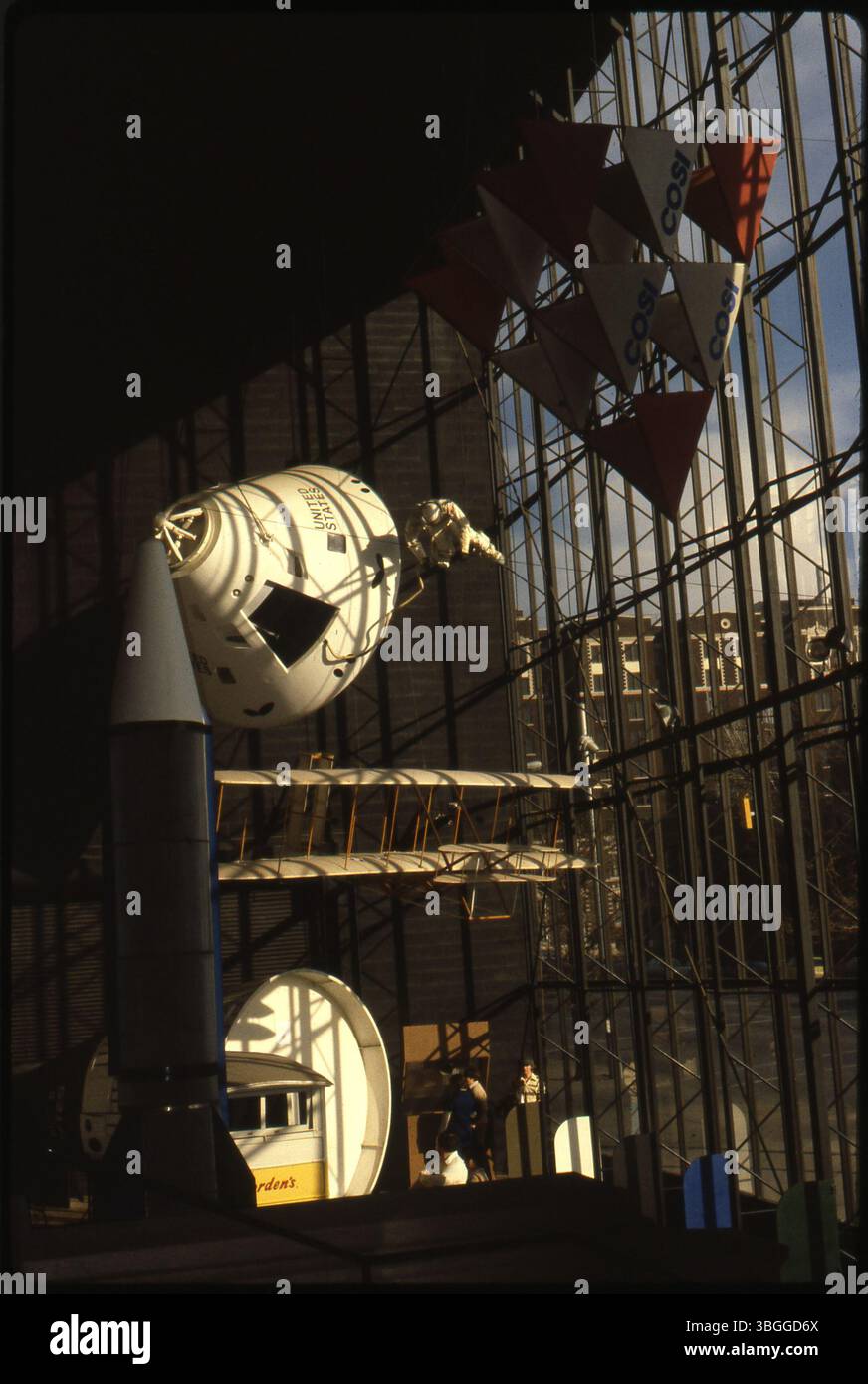 A view of the glass atrium at COSI, featuring exhibits like an ...